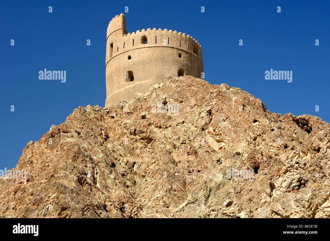 Old defense tower on the bare hills surrounding Muscat, Sultanate of ...
