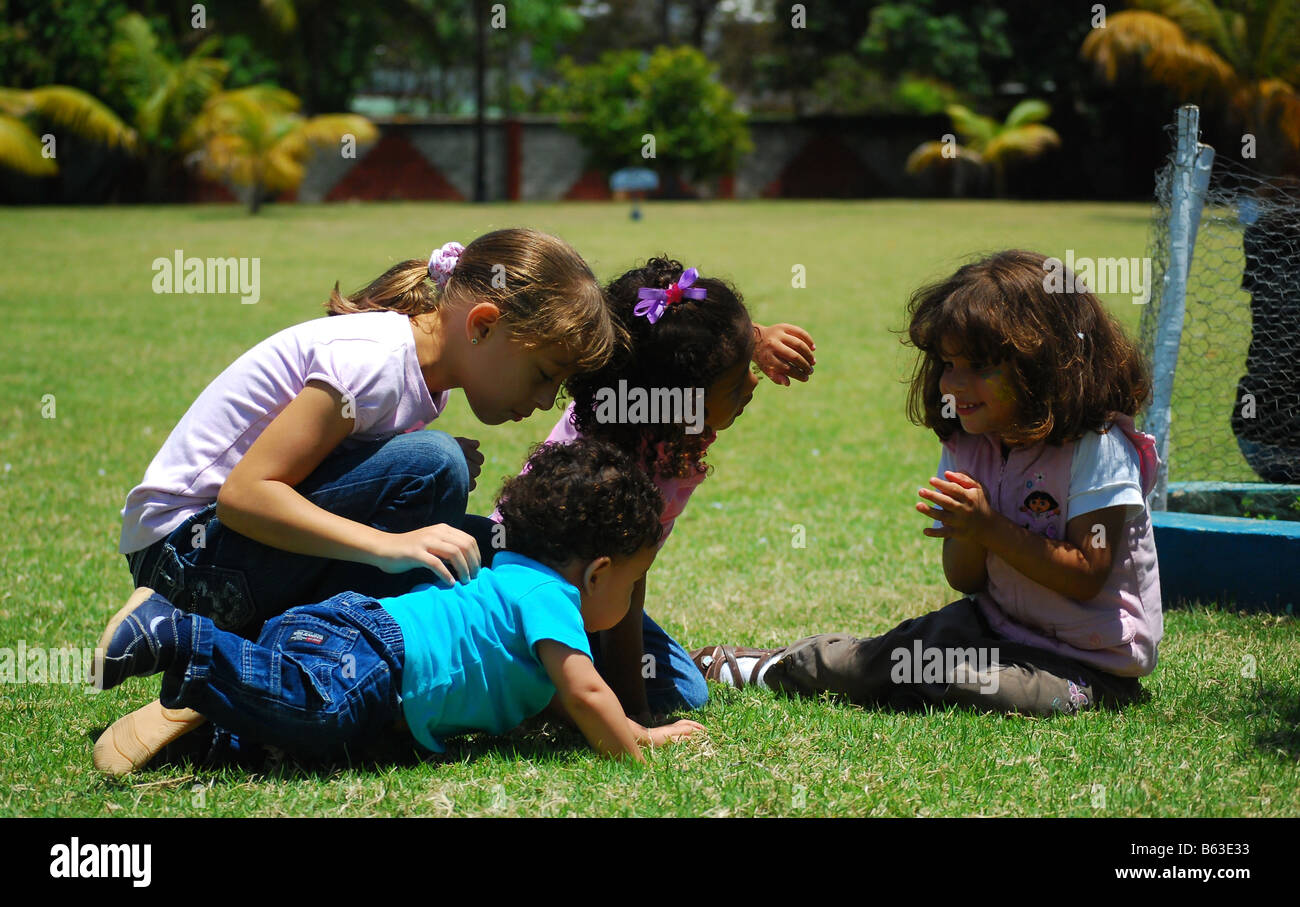 A group of children playing in the backyard Stock Photo - Alamy