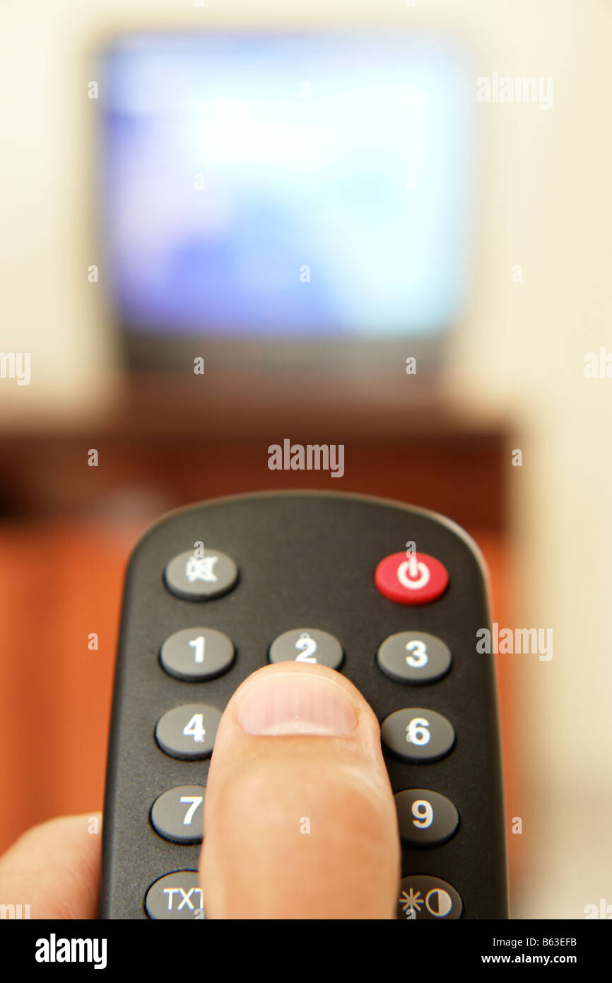 Television screen with tv remote control in foreground Stock Photo - Alamy