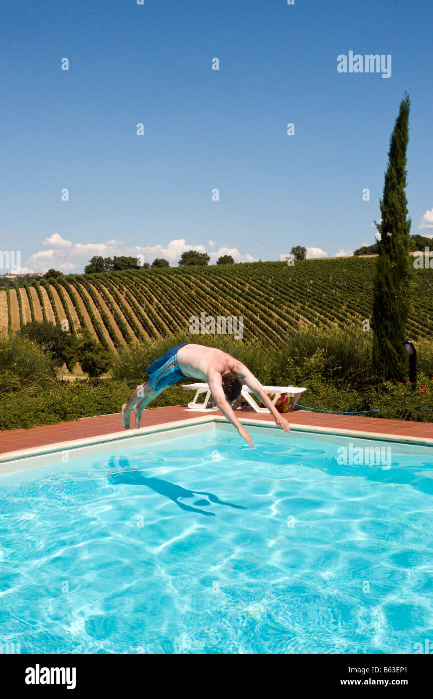 Man diving in a pool Tuscany Italy Stock Photo - Alamy
