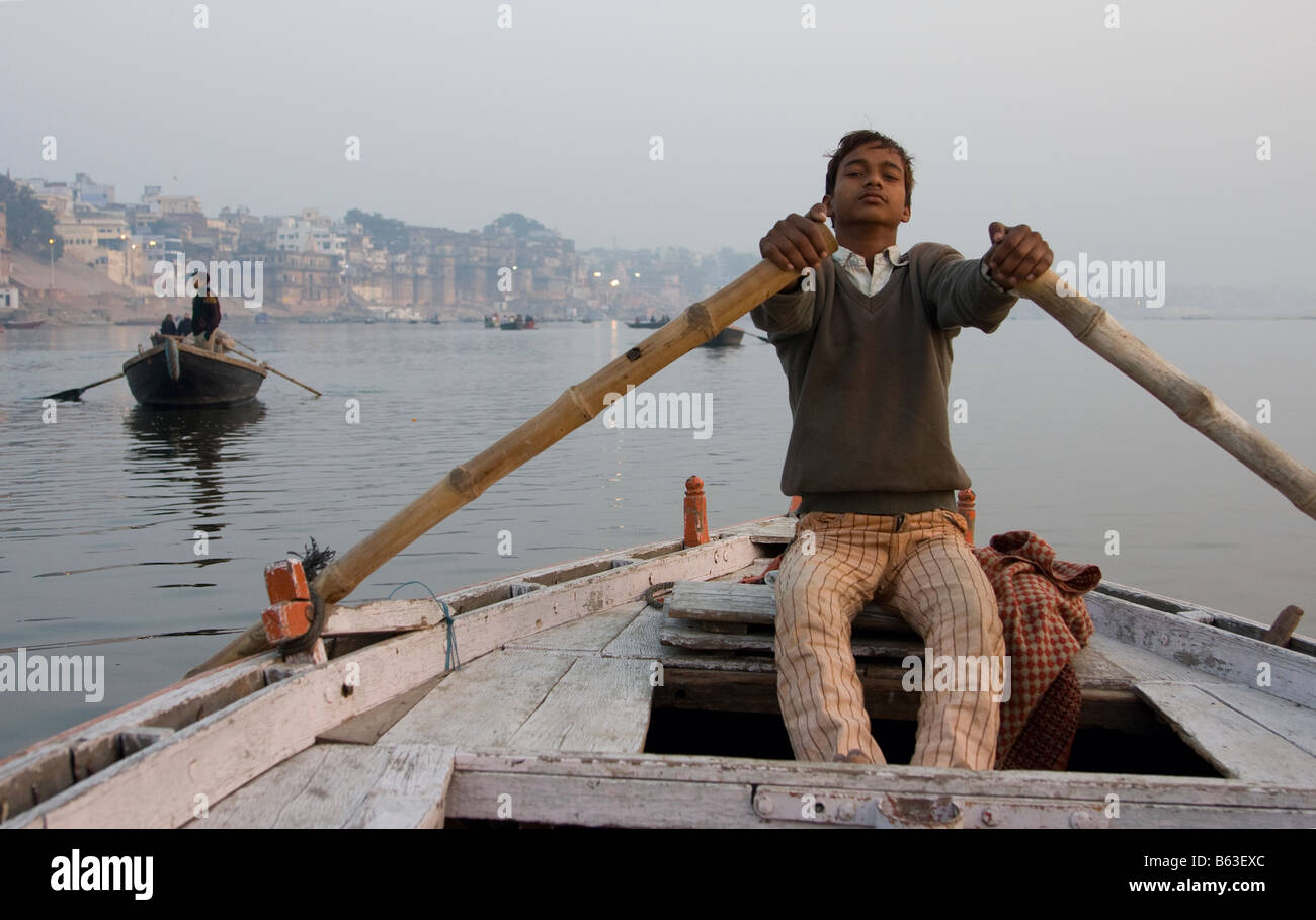A boy rows a boat on the Ganges India s most sacred river Varanasi ...