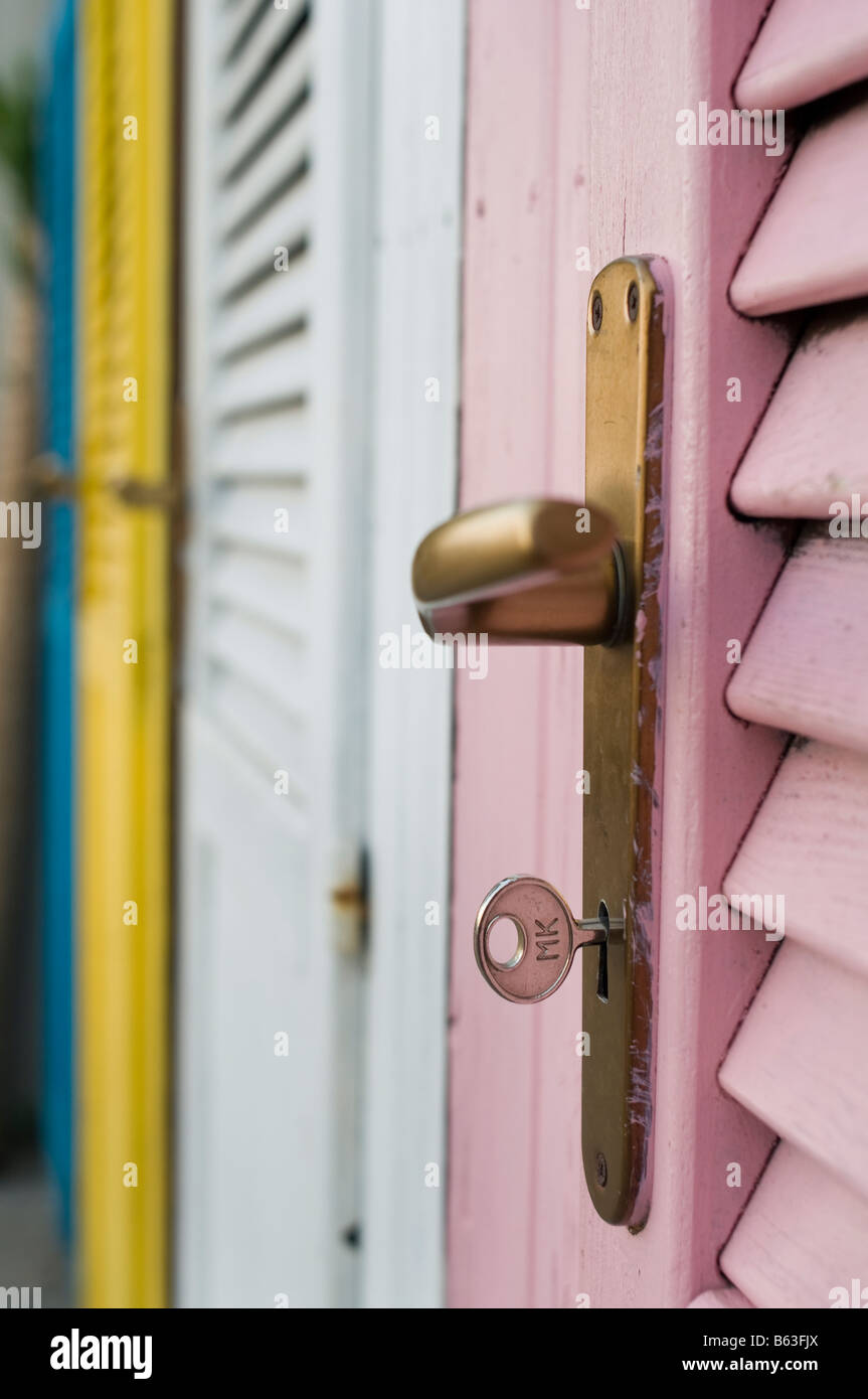 Door handle and key on colorful door Stock Photo - Alamy