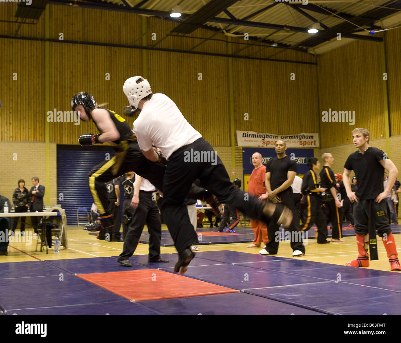 Competitors fighting in a kung fu tournament Stock Photo - Alamy