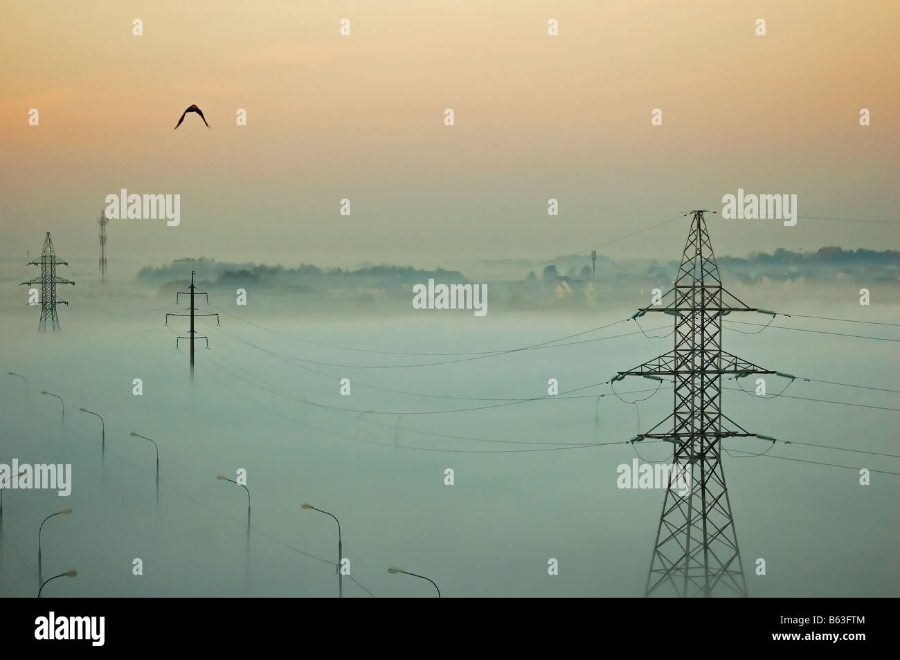 Electric line in a fog Stock Photo - Alamy