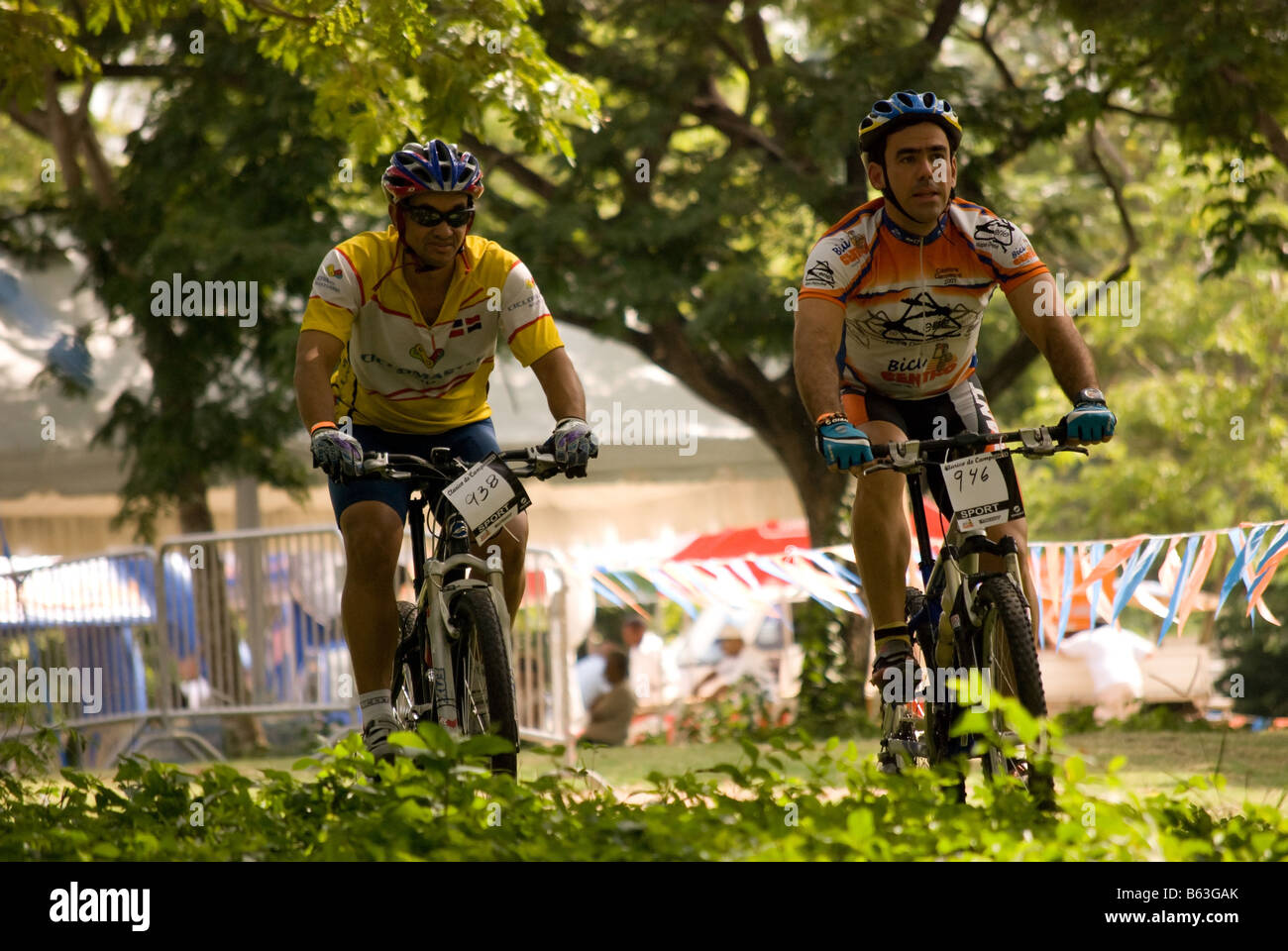 Hispanic teen riding bike hi-res stock photography and images - Alamy