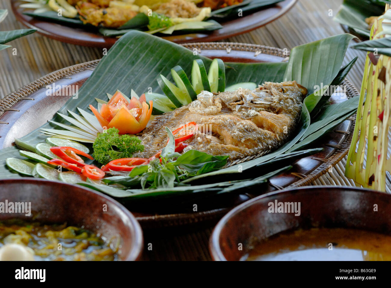 Fish fried with the nice garnish Stock Photo - Alamy