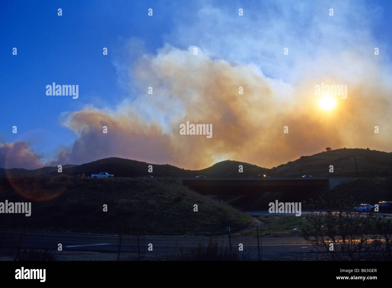 Smoke filled sky above brush fire in Orange County, California, USA sun ...