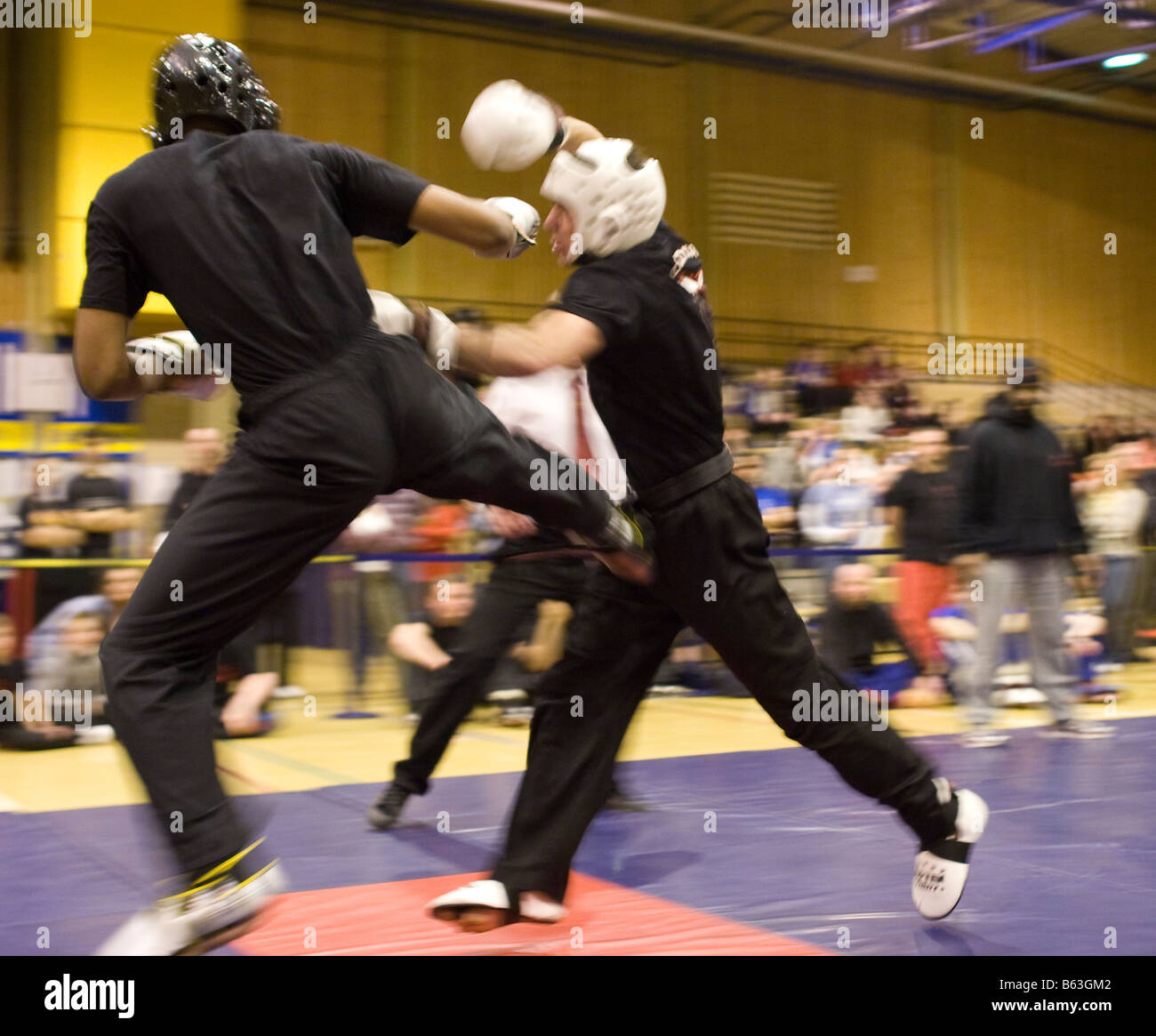 Competitors fighting in a kung fu tournament Stock Photo - Alamy