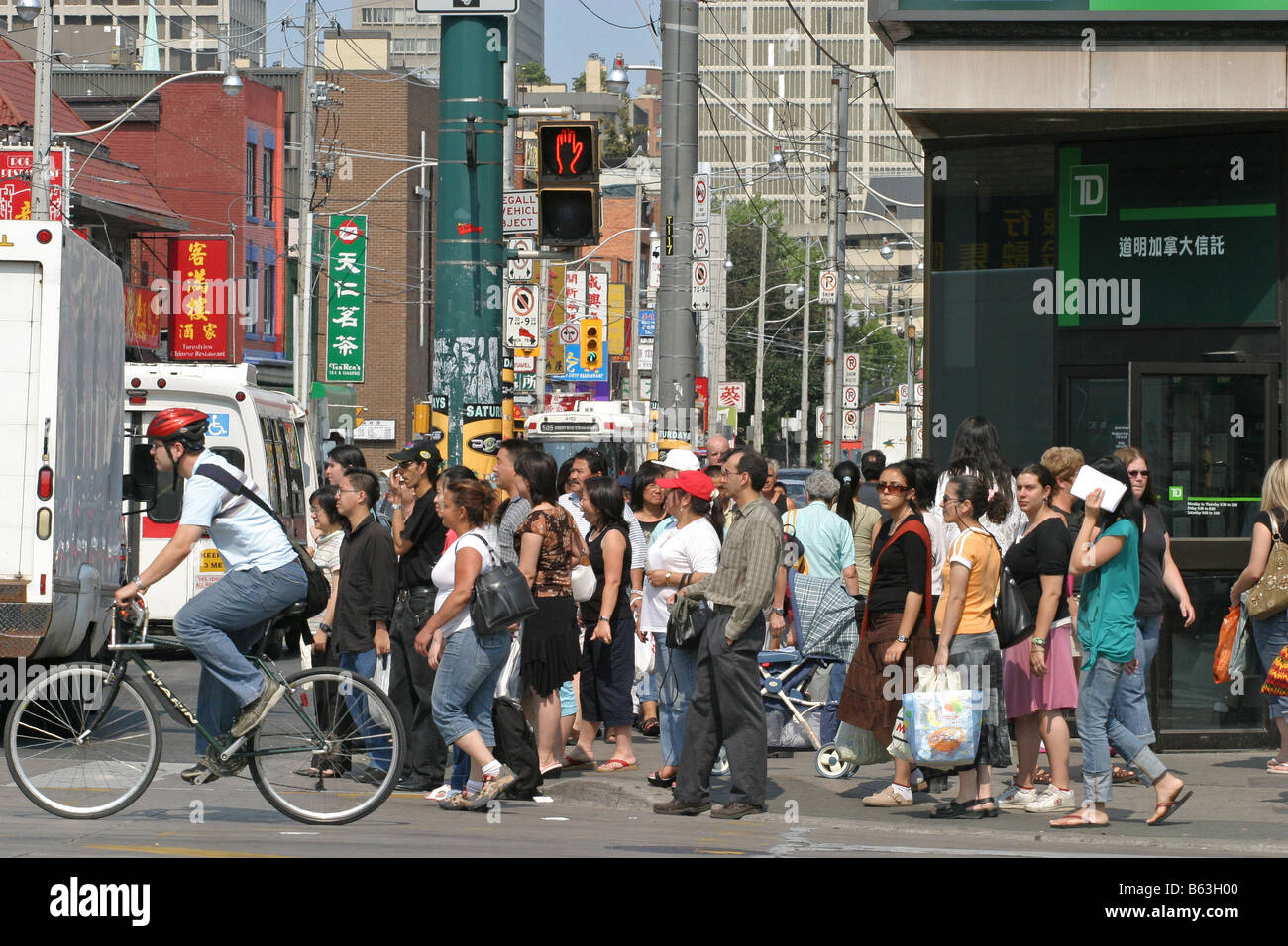 pedestrians crossing street at downtown intersection Stock Photo - Alamy