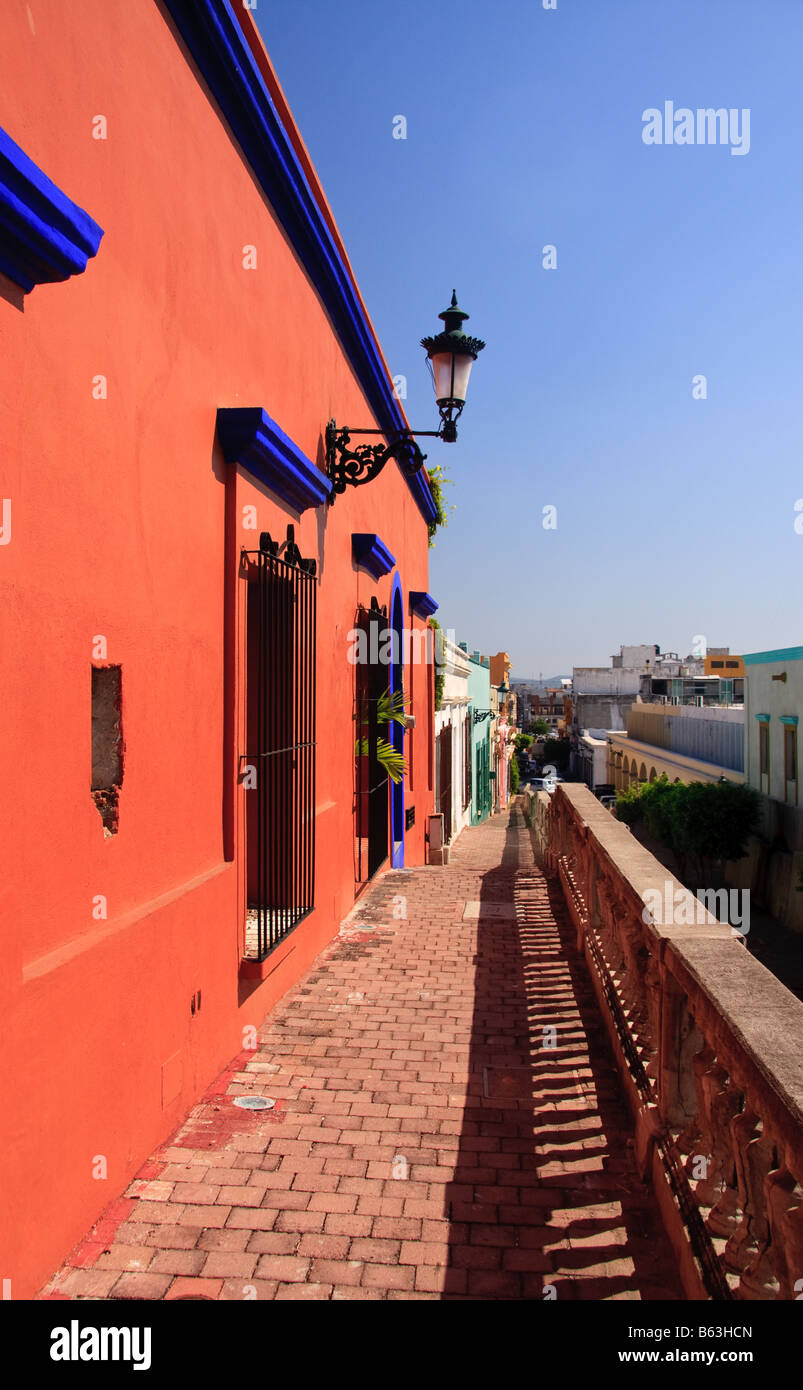 Ancient pathway in Mazatlan with bright red buildings Stock Photo - Alamy