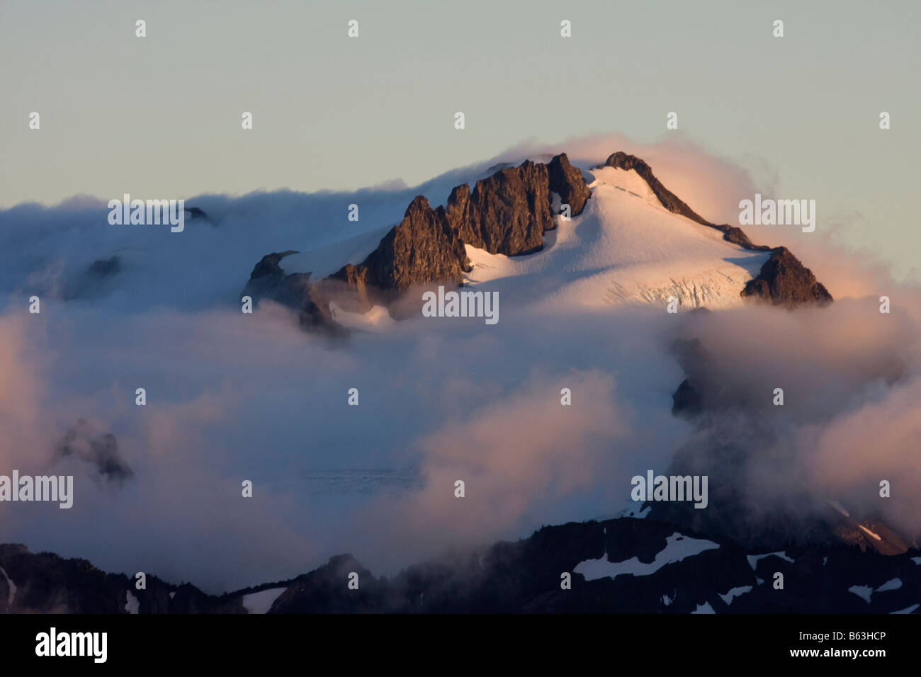 Clouds begin to lift and reveal Mt Tom in Olympic National Park ...