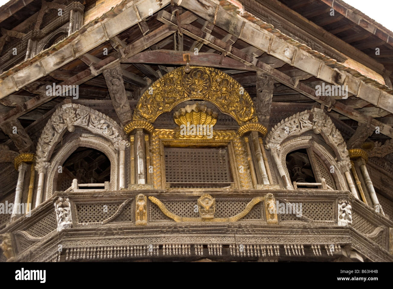 Gold and wooden window on a temple in the Durbar square in Kathmandu ...