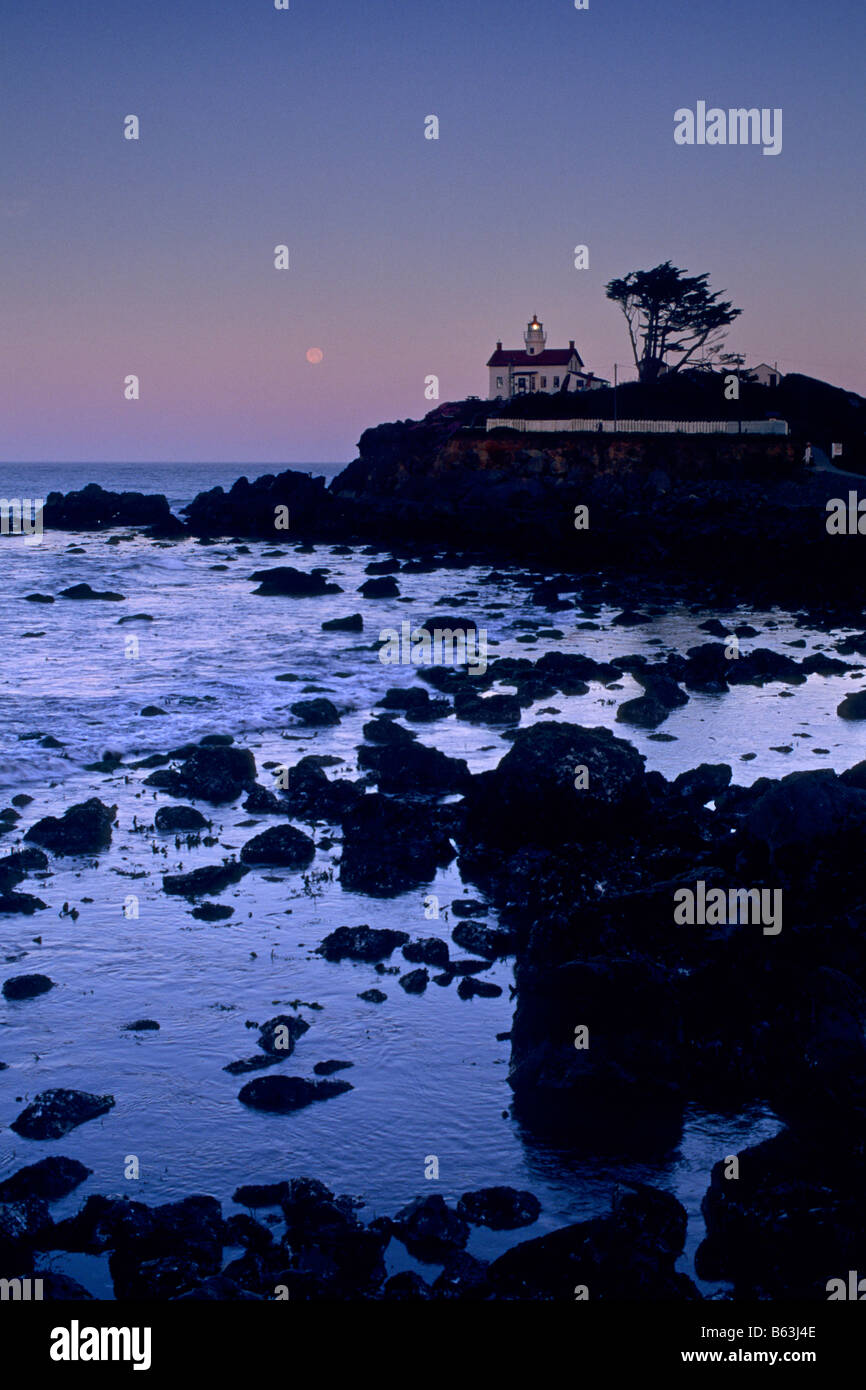 Full moon setting over Battery Point Lighthouse Crescent City Del Norte ...