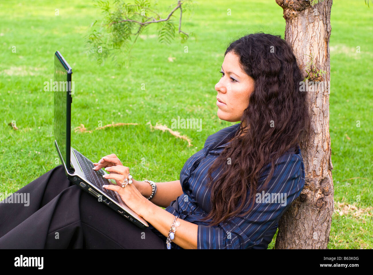 woman with laptop outdoors Stock Photo - Alamy