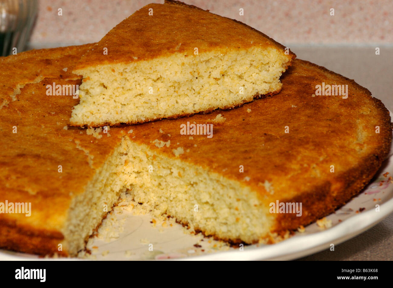 Cornbread on a serving plate This bread was baked southern style in a ...