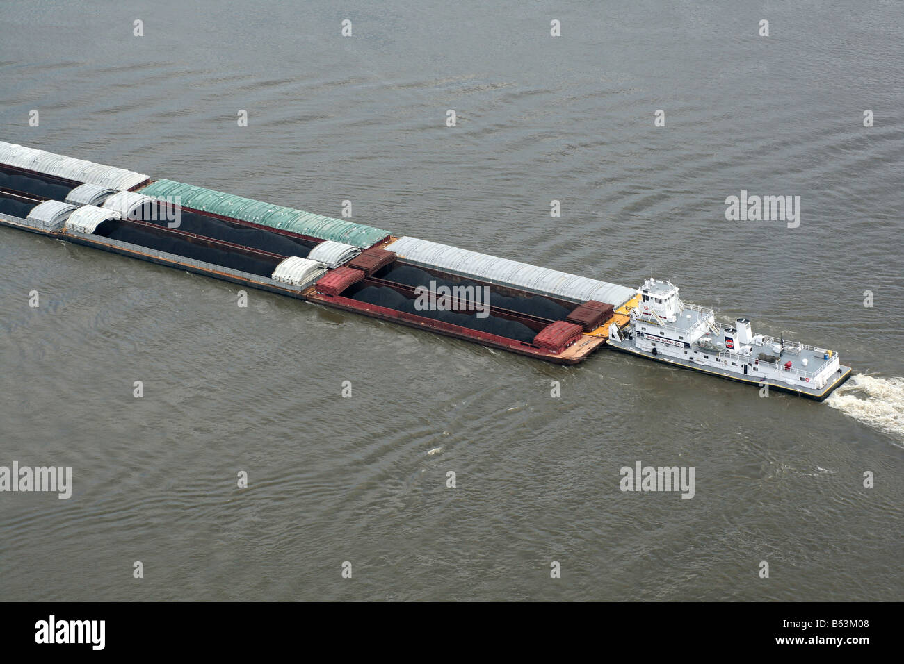 Coal barge pushes up Mississippi river at St Louis Missouri Stock Photo ...