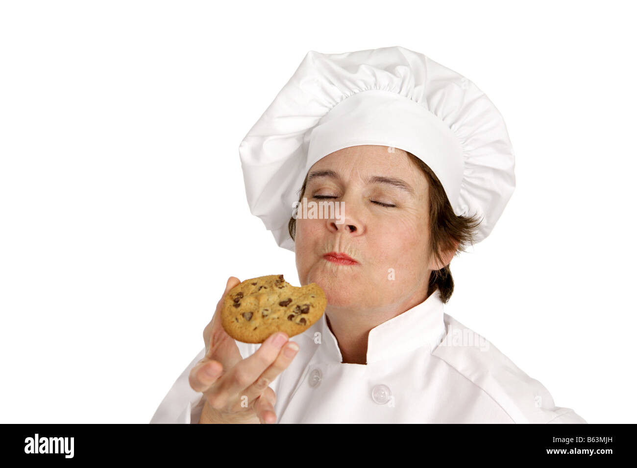 Chef enjoying a delicious chocolate chip cookie she just baked Isolated ...