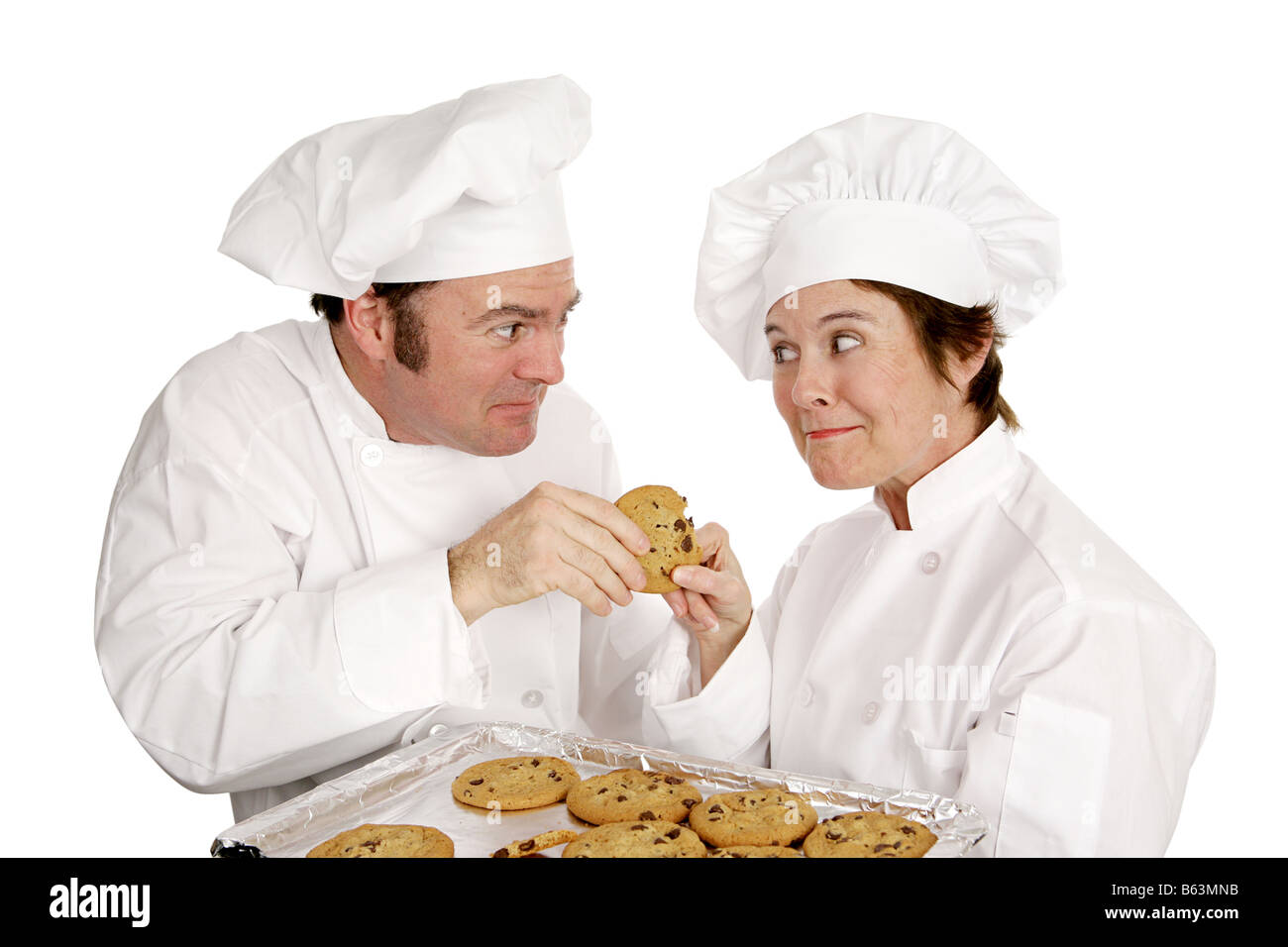 Two chefs fighting over a freshly baked chocolate chip cookie Isolated ...