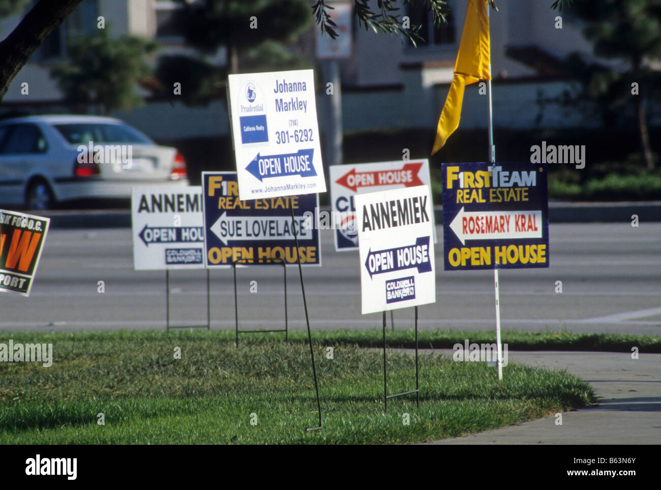Real estate signs fill corner site Stock Photo - Alamy