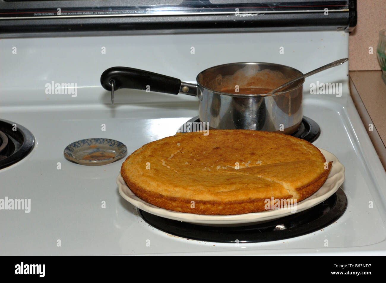 Cornbread on a serving plate This bread was baked southern style in a ...