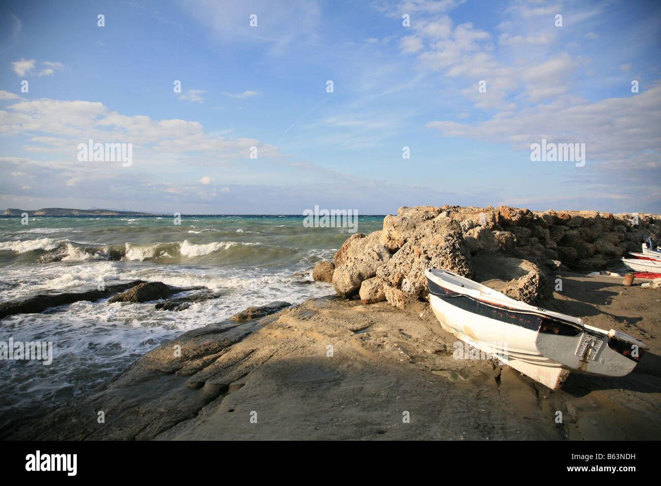 Boat on the Rocks Stock Photo - Alamy