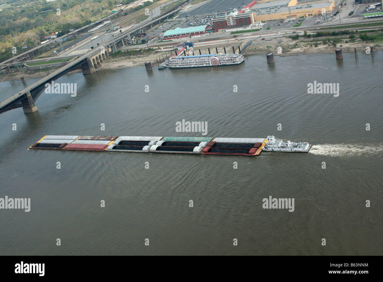 Coal barge approaches Eads bridge on Mississippi river at St Louis ...