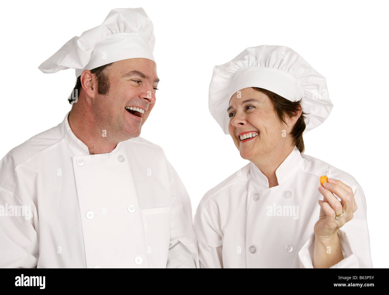 A male and female chef laughing together Isolated on white Stock Photo ...