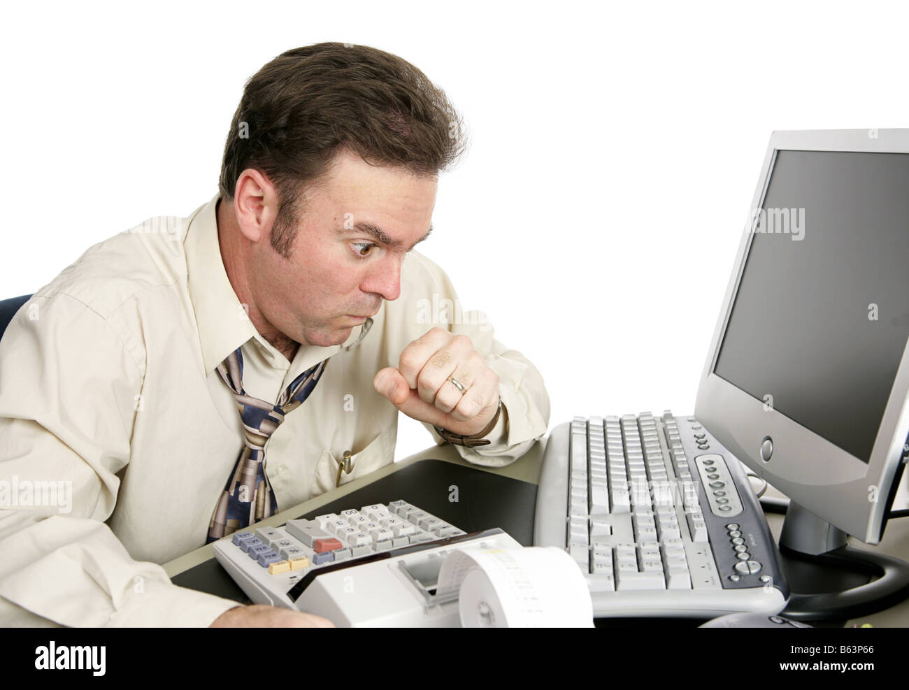 A man choking or coughing while working on the computer His eyes are ...