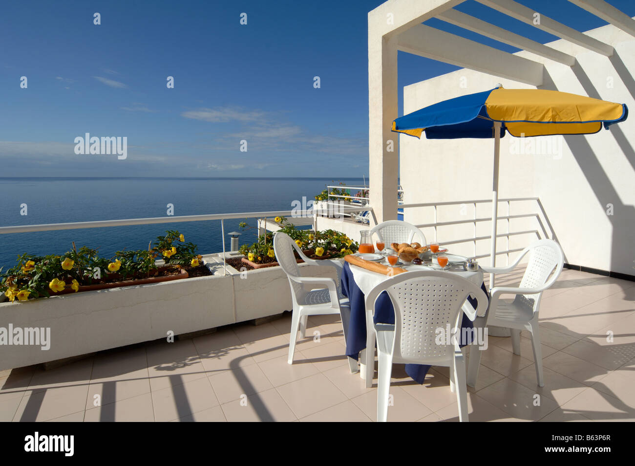 Breakfast table in sunshine Stock Photo - Alamy