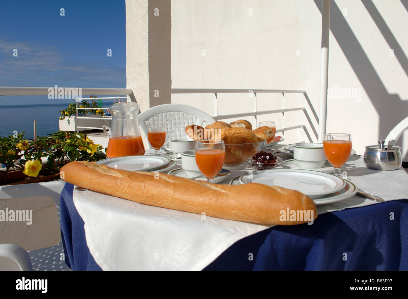 Breakfast table in sunshine Stock Photo - Alamy