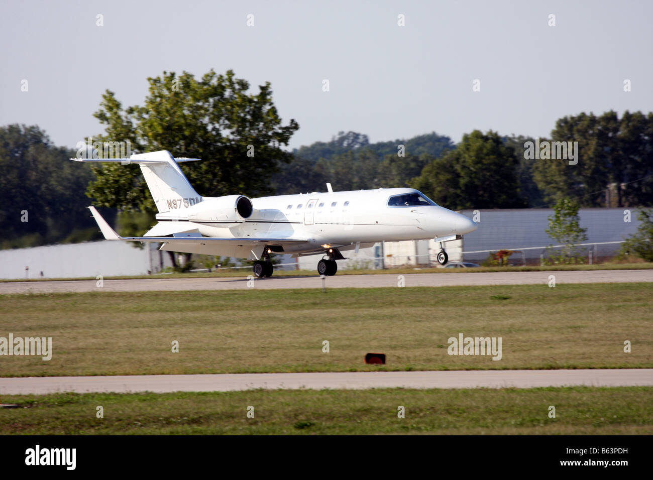 A private jet landing at an airport in Wisconsin Stock Photo - Alamy