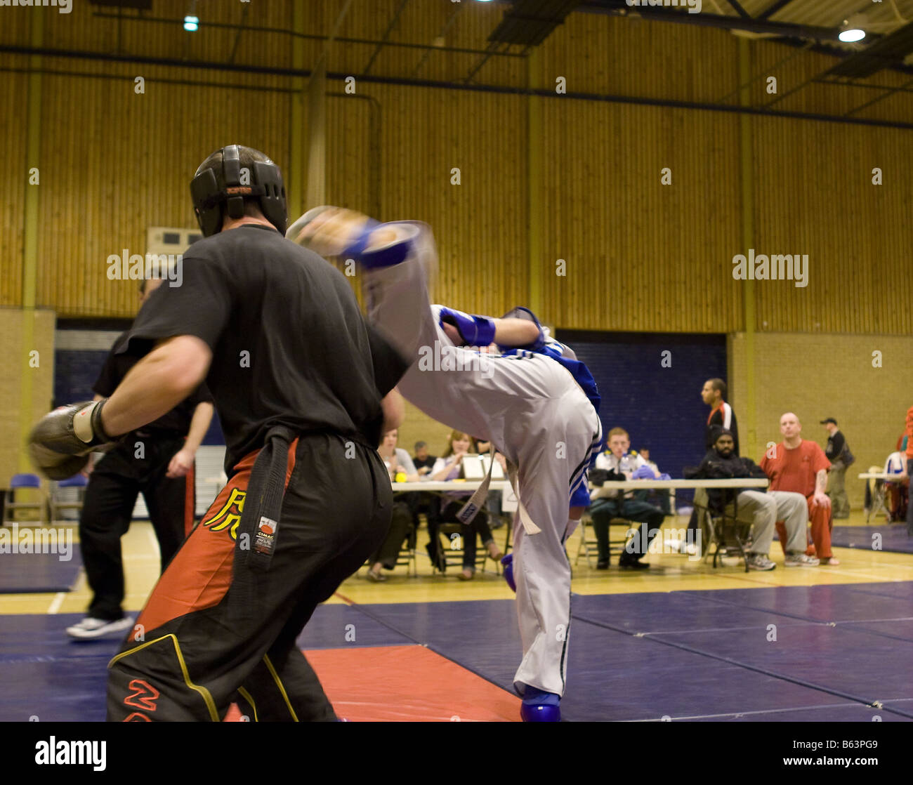 Competitors fighting in a kung fu tournament Stock Photo - Alamy