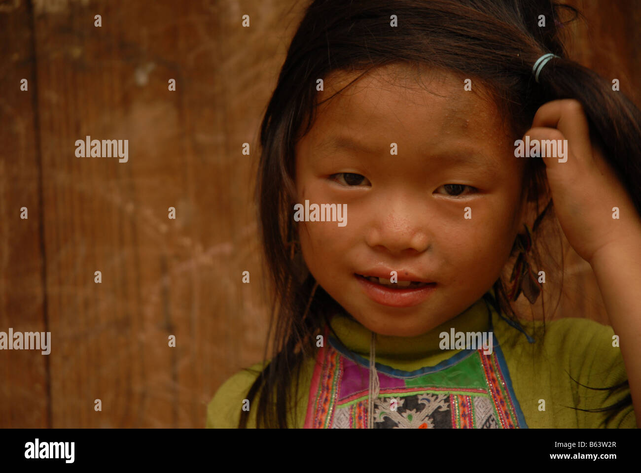 A little girl in a small village in rural Guizhou Province, China. She ...