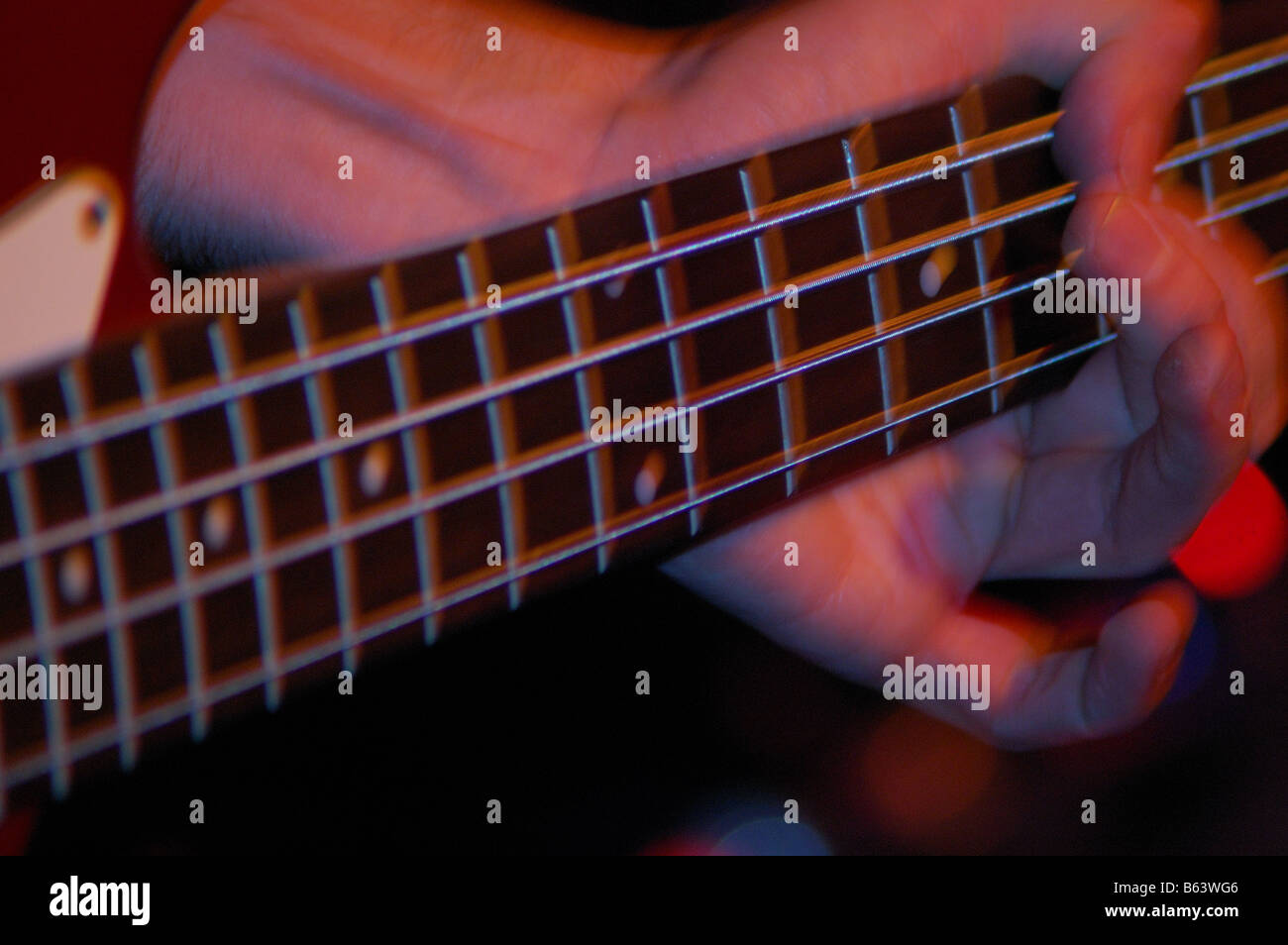 Close up of guitarist's hand strumming an electric guitar Stock Photo ...