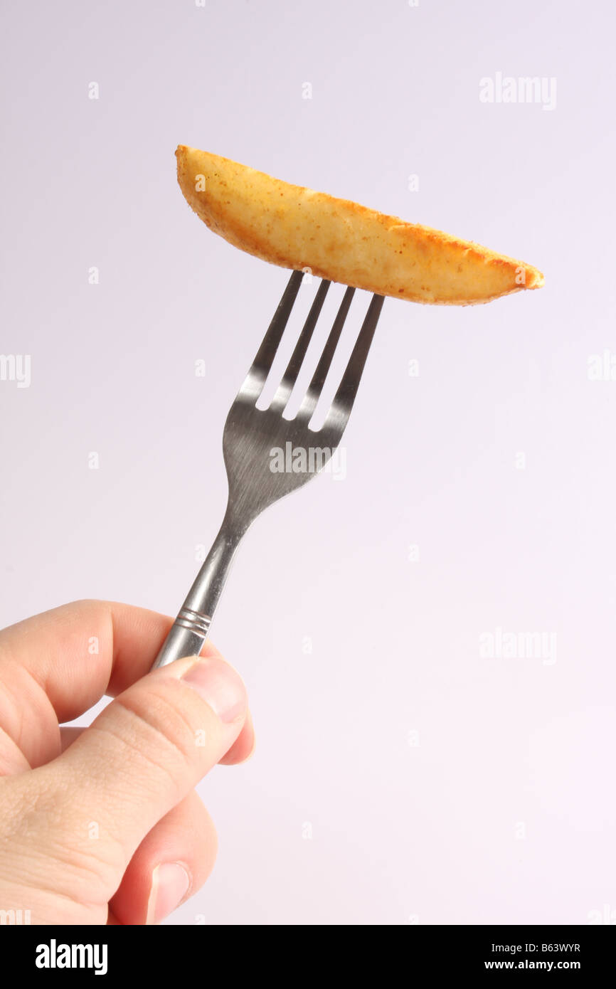 A chip on a fork Stock Photo - Alamy