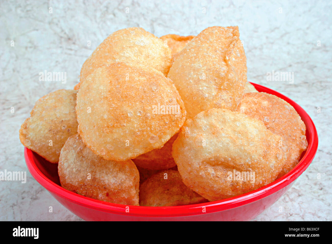 Closeup of Hot fried Puri's (Indian Bread) in a dish Stock Photo - Alamy