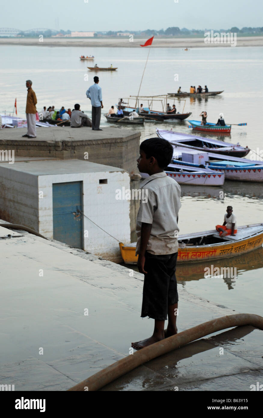Boy standing by the river Ganges, Varanasi, India Stock Photo - Alamy