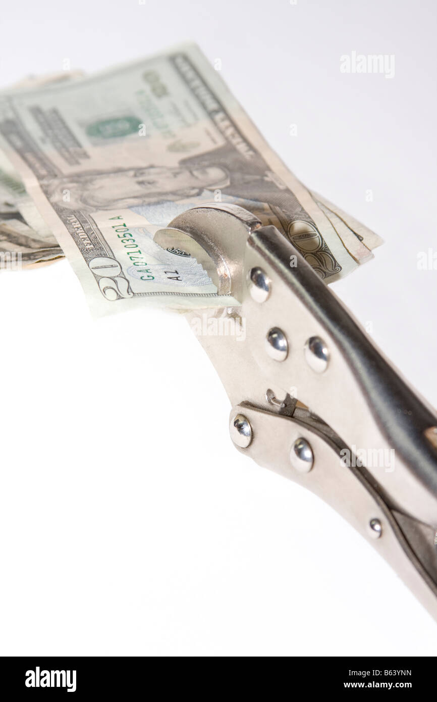 Money being held tightly by a pair of pliers on a white background ...