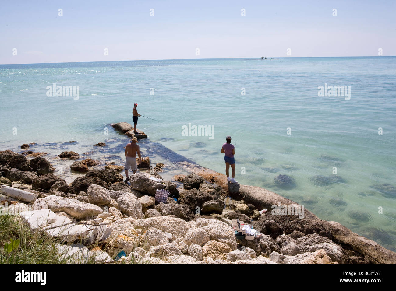 Fishing from rocks Stock Photo - Alamy