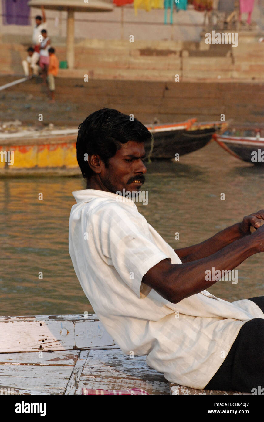 boatman rowing down the Ganges river. Varanasi India Stock Photo - Alamy