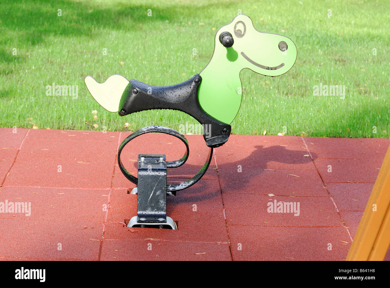 Kids rocker on the playground Stock Photo - Alamy