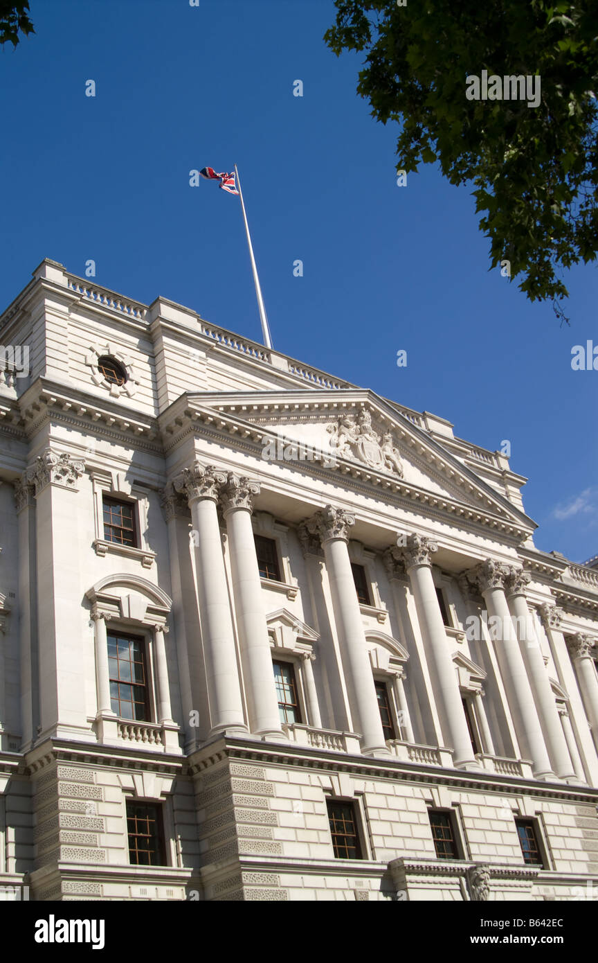 Detail of white classical building with columns and UK flag against ...