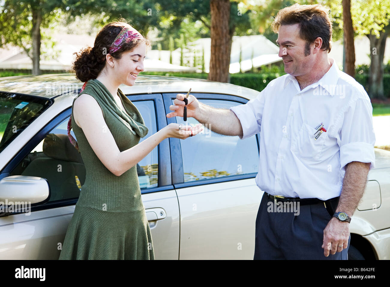 Woman handing over the car keys hi-res stock photography and images - Alamy