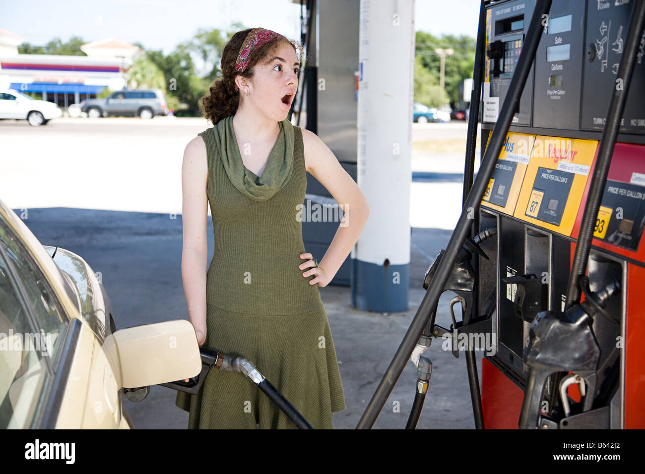 Teen filling up her car hi-res stock photography and images - Alamy
