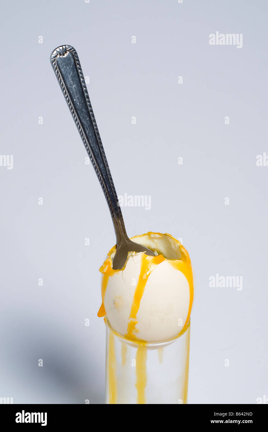 eaten hard boiled egg with spoon inside Stock Photo - Alamy