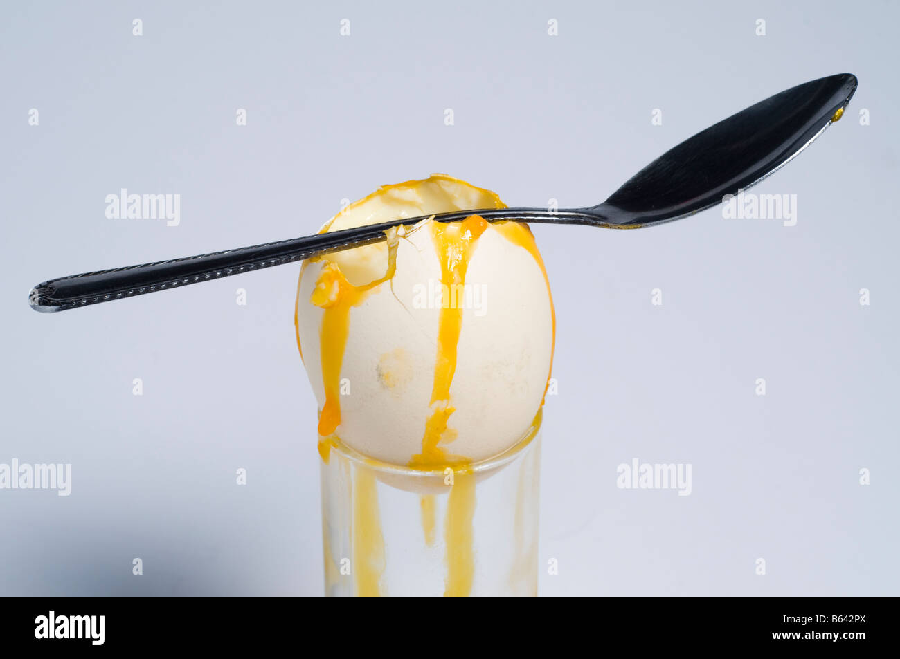 eaten hard boiled egg with spoon inside Stock Photo - Alamy
