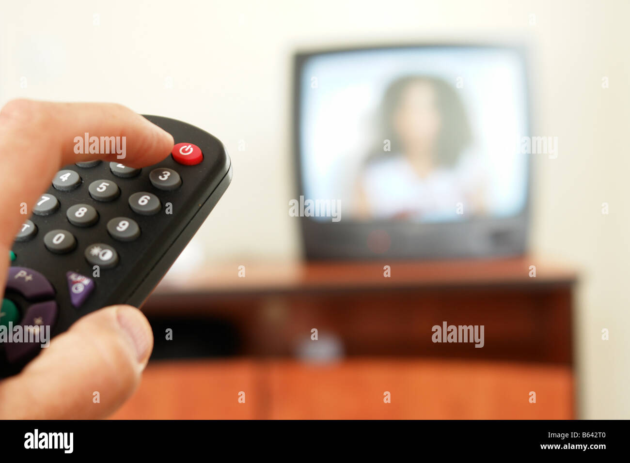 Television screen with tv remote control in foreground Stock Photo - Alamy