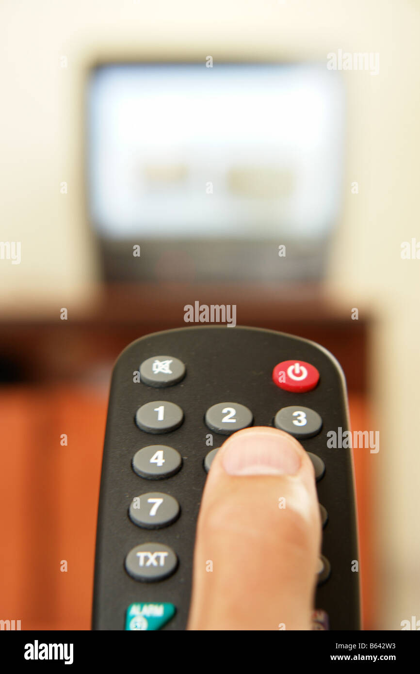 Television screen with tv remote control in foreground Stock Photo - Alamy