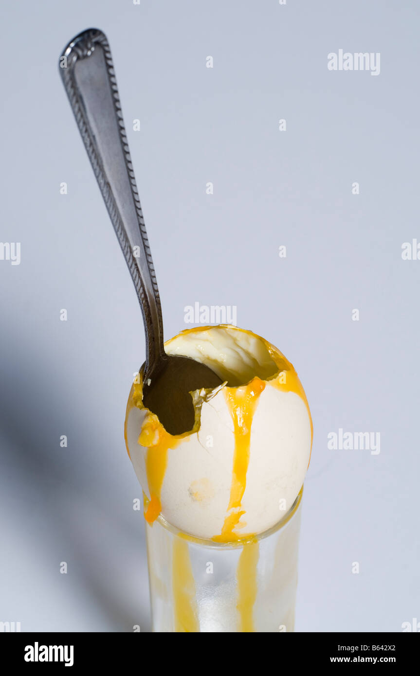 eaten hard boiled egg with spoon inside Stock Photo - Alamy