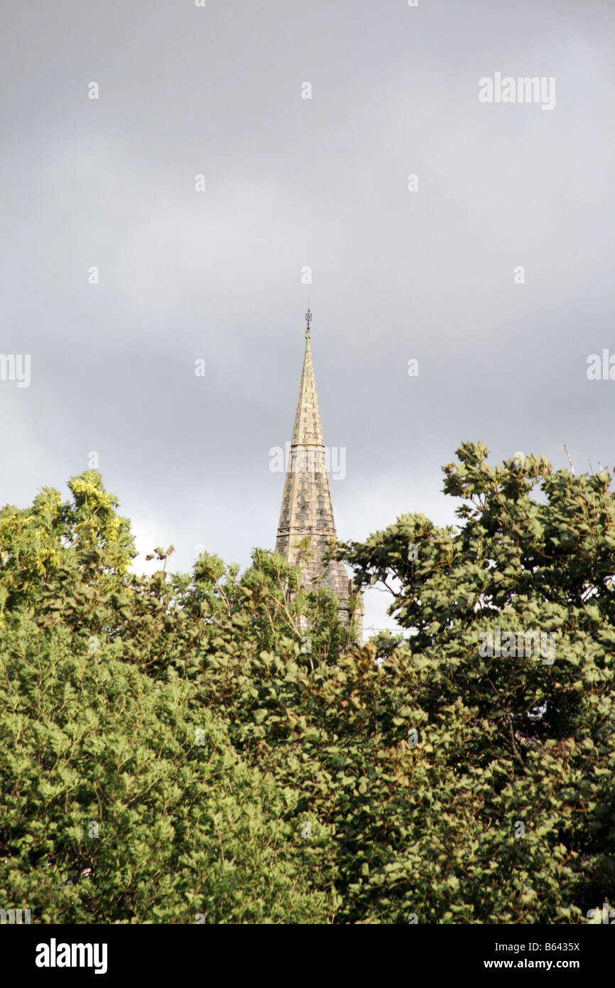 church spire and dark clouds in rural landscape Stock Photo - Alamy